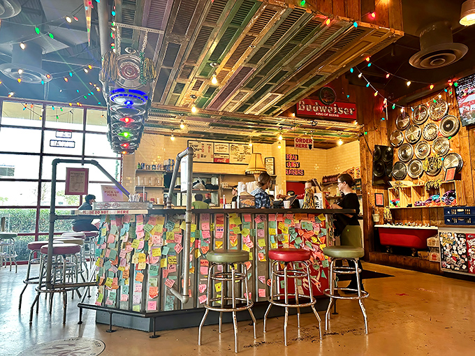Vintage hubcaps hang from the ceiling like metallic chandeliers, proving that one person's junk yard is another's restaurant decor inspiration.