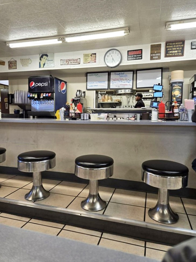 Classic diner counter seating&mdash;where solo diners become temporary neighbors and coffee refills arrive before you even ask.