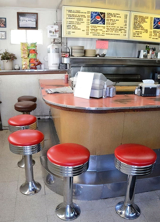 Classic counter seating where the red vinyl stools have witnessed decades of first dates, business deals, and "I'll just have one more cup" promises.