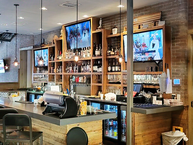 The bar area &ndash; where bourbon bottles stand at attention, ready to complement whatever smoky delicacy you've chosen from the menu.