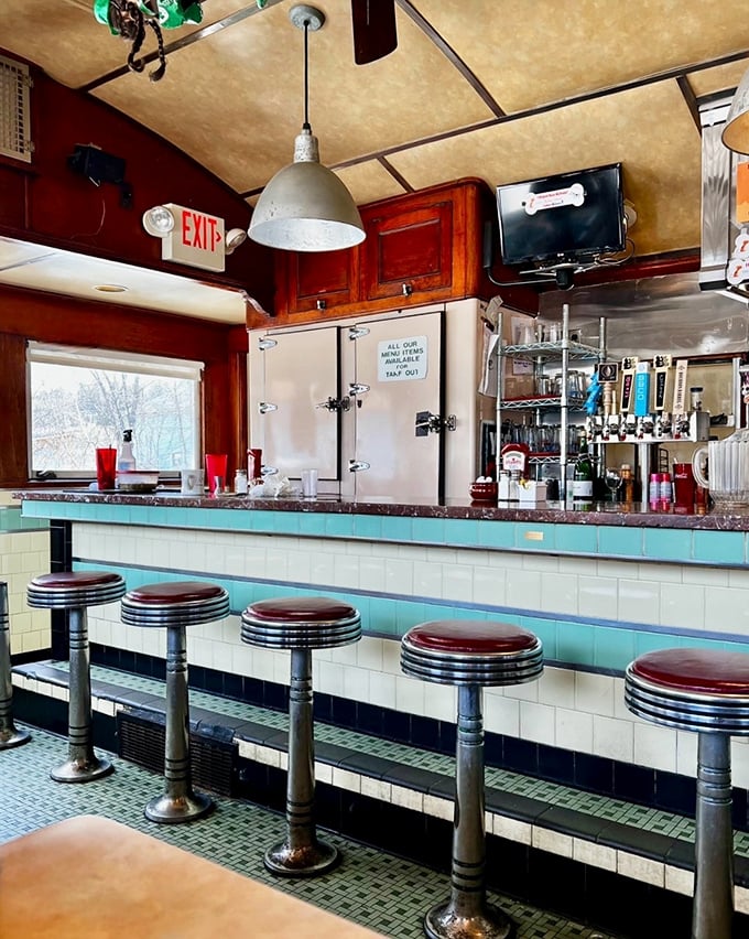 Classic counter seating in turquoise and chrome&mdash;where solo diners become part of the family and coffee cups are never empty.