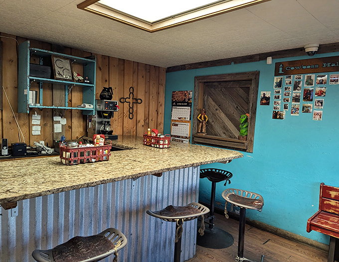 The counter features corrugated metal and turquoise walls, combining ranch house chic with genuine small-town breakfast bar charm.