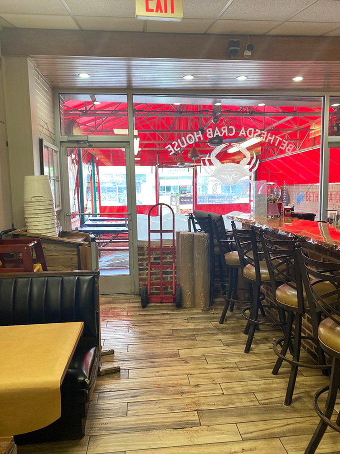 Looking through to the iconic red awning from inside&mdash;this view has welcomed countless crab enthusiasts seeking Maryland's authentic seafood experience.