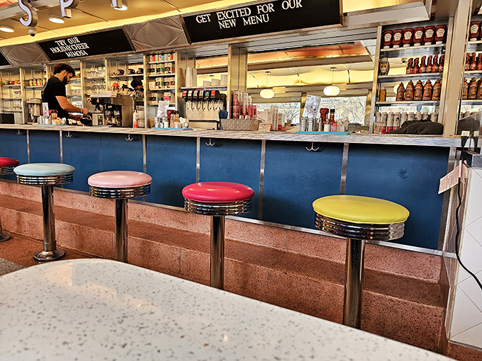 The counter seats&mdash;where breakfast aficionados earn their stripes. Those colorful stools have witnessed countless first sips of morning coffee.