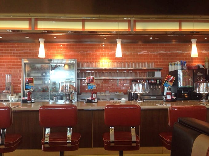 Classic counter seating with those iconic red chairs&mdash;where solo diners become temporary family and coffee refills appear like magic.