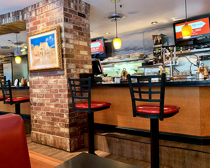 The counter seating offers front-row tickets to the breakfast theater. Some come for the food, others for the show.