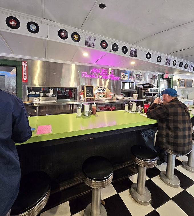 Counter seats offering front-row views of the culinary action, where watching your meal being made is half the entertainment value.