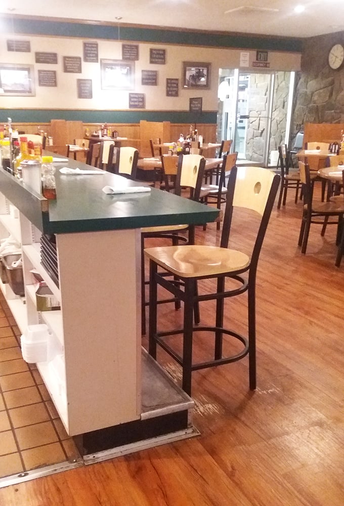 Counter seating: where solo diners become family and coffee refills arrive before you even ask. The breakfast equivalent of front-row seats.