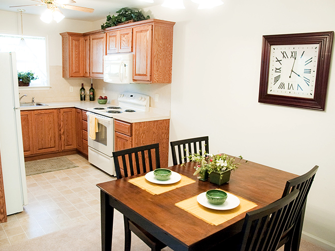 Kitchens designed for real cooking, not just reheating. Warm wood cabinetry and practical layouts make meal prep a pleasure rather than a chore.