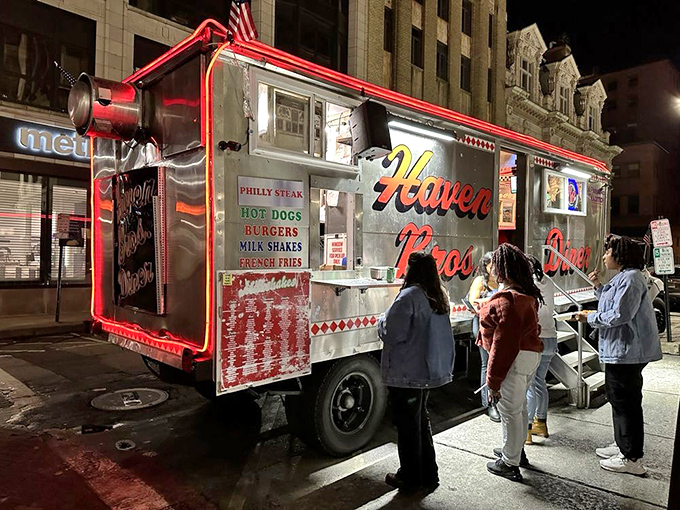 The silver exterior glows like a UFO of deliciousness, drawing curious earthlings to its orbit with promises of late-night culinary satisfaction.