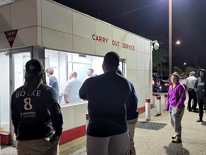 Late-night pilgrims gather outside the carry-out window, drawn by the siren call of sliders that taste even better after midnight.