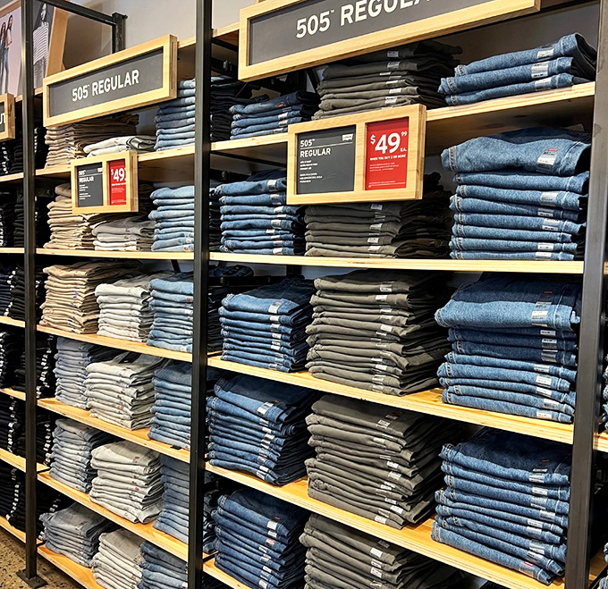 Levi's 505s stacked with military precision. The denim promised land where finding your size feels like winning the lottery.
