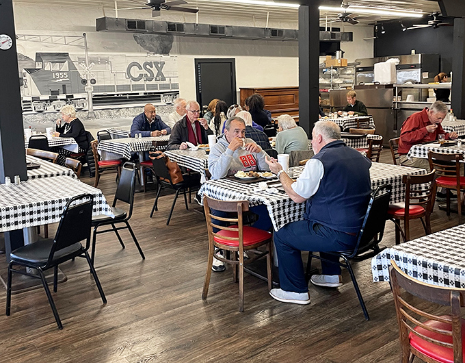 Where conversations flow as freely as sweet tea, and regulars have claimed their favorite tables through decades of loyal patronage.