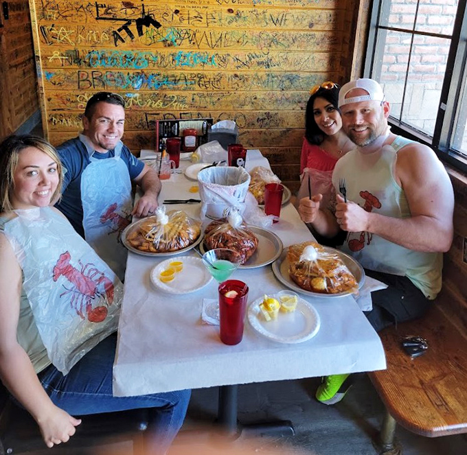 Happy diners in their plastic bibs &ndash; the universal uniform of serious seafood enthusiasts who understand good food is worth getting messy for.