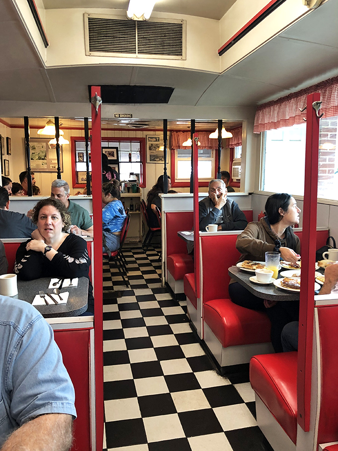 The classic diner aisle&mdash;where servers perform the daily ballet of coffee pots and plates while regulars exchange news across checkered floors.