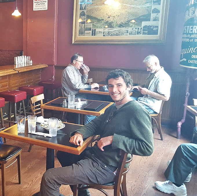 The dining room buzzes with the energy of people who know they're about to experience something special—seafood with a side of Portland history.