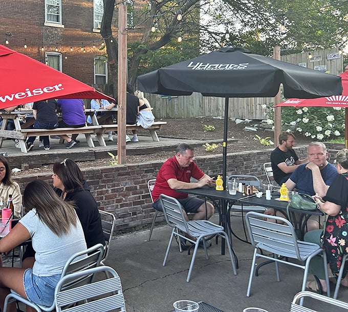 The outdoor patio where strangers become friends over shared appreciation of smashed burger perfection and cold drinks.