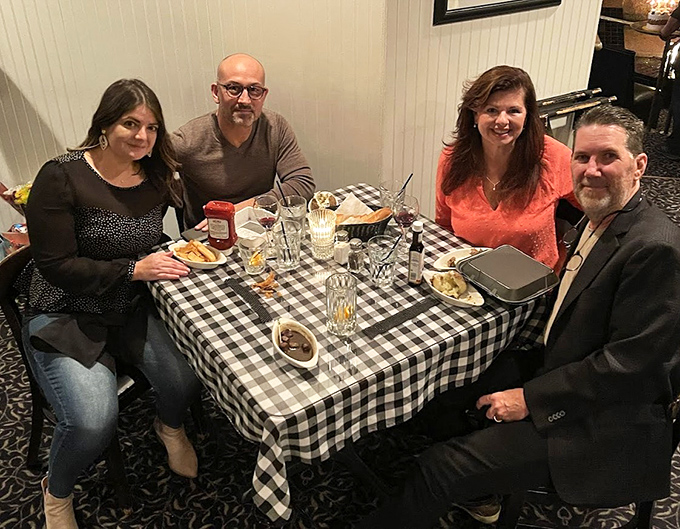 The restaurant brings together friends and families who understand that great meals aren't just about food &ndash; they're about shared moments around checkered tablecloths.
