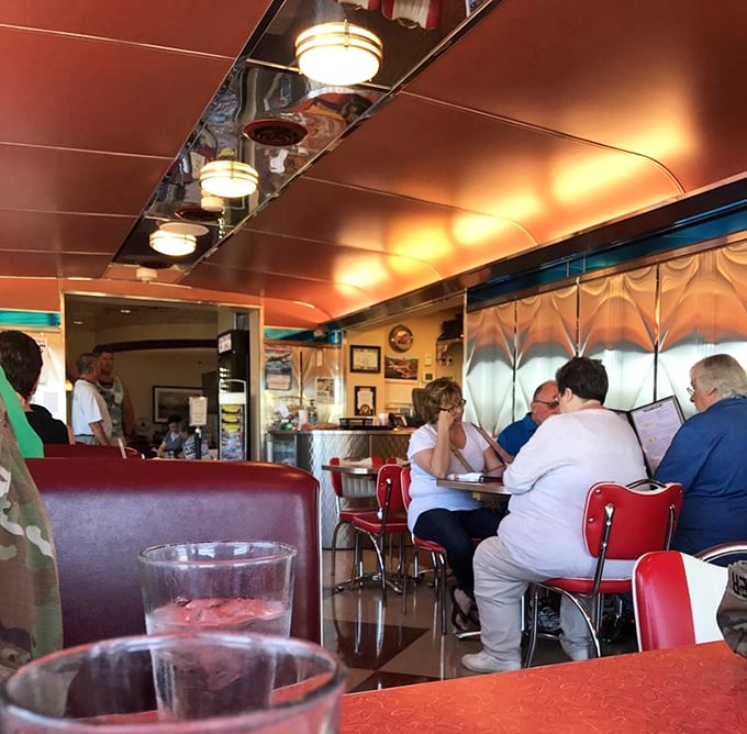 Where strangers become neighbors over coffee refills and shared appreciation for a place where conversation flows as smoothly as the maple syrup.