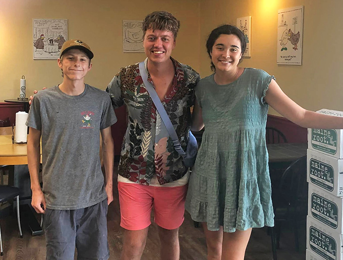 Happy customers making memories over meals. The universal language of great food brings people together in this cozy spot.