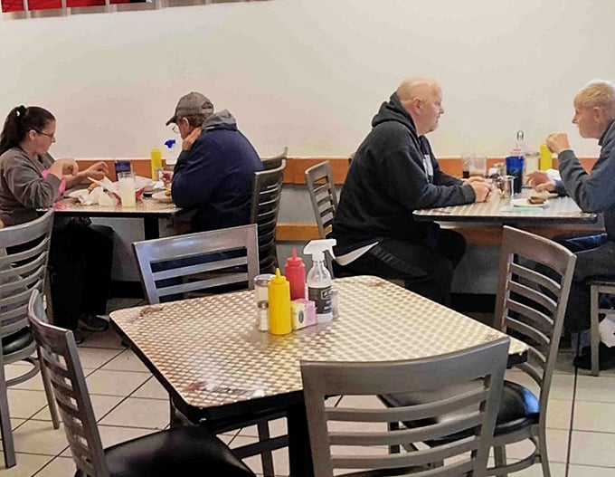 The morning crowd at B&N, where conversations flow as freely as the coffee. These tables have heard decades of local news, gossip, and friendly debates.