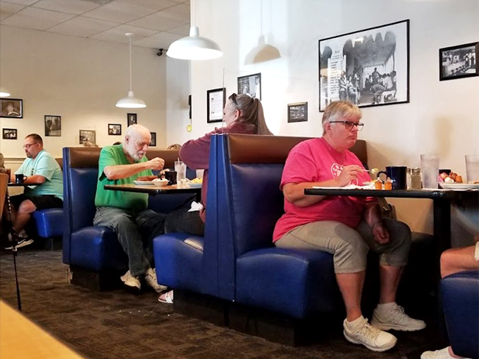 Happy diners in their natural habitat, enjoying meals that make the world feel right again.