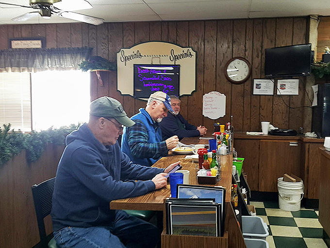 The counter seating—where regulars exchange local wisdom and newcomers are just friends who haven't been introduced to the coffee yet.