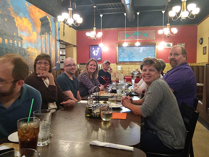 Happy diners proving that the universal language isn't love &ndash; it's a table full of Italian comfort food.