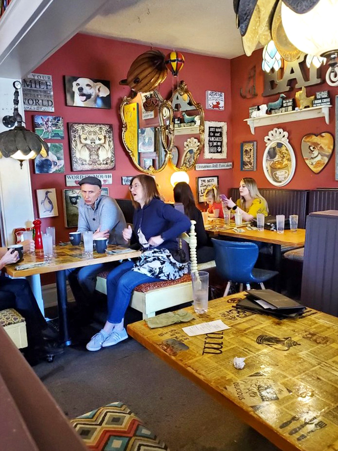 The dining room's wall art collection rivals most galleries, except here each piece seems to whisper, "Eat something delicious."