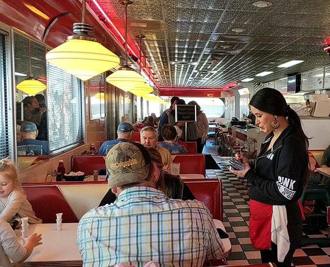 A bustling morning at Georgie's, where servers navigate the checkered floor like chess pieces and regulars hold court in their favorite booths.