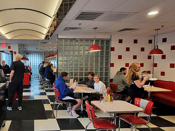 This is what a happy diner looks like: people of all ages gathered together, united by good food and better company.