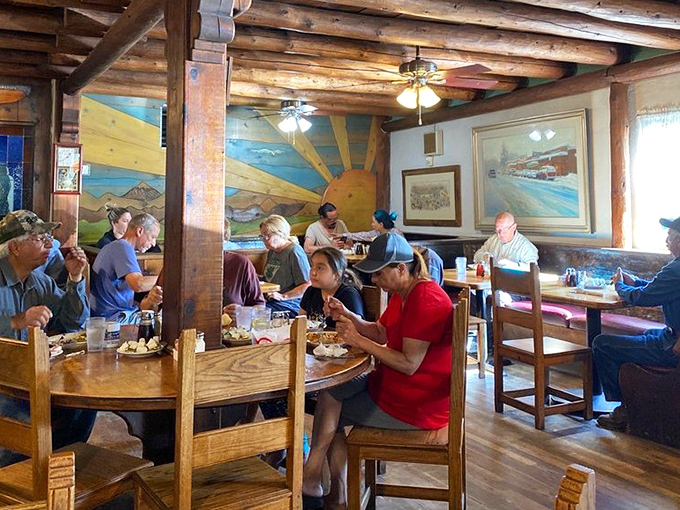 The true measure of a great restaurant: locals and tourists alike, heads bowed in reverence to the plates before them.