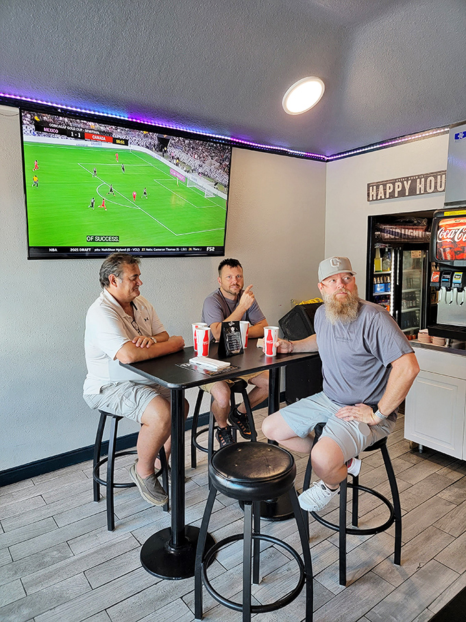 Friends gathered around watching the match, cold drinks in hand, living their best Tuesday afternoon like champions of leisure time.