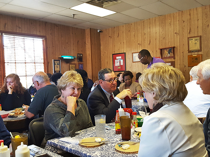Where business suits and work boots meet over plates of fried chicken. Martin's dining room is Alabama's great equalizer.