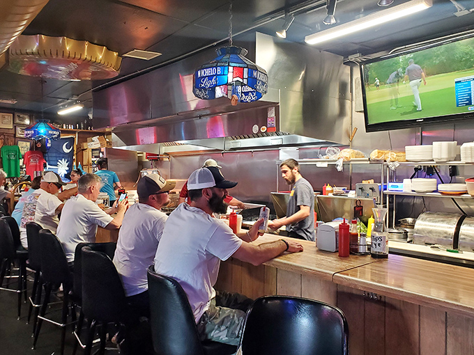 The counter seating puts you front-row for the culinary show, where regulars and first-timers share the same anticipation.