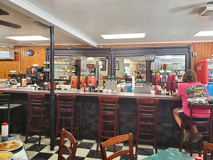 The counter seating&mdash;where solo diners become temporary neighbors and the coffee refills flow like conversation between old friends.