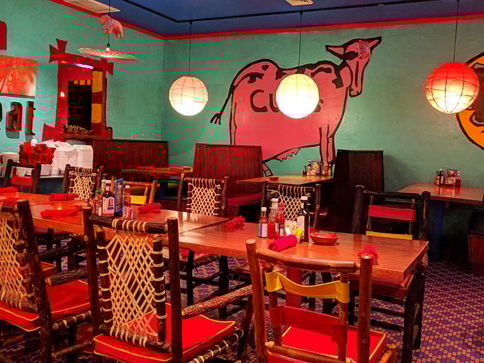 Dining room walls adorned with a cow mural that seems to say, "Yes, I sacrificed for your meal. You're welcome."