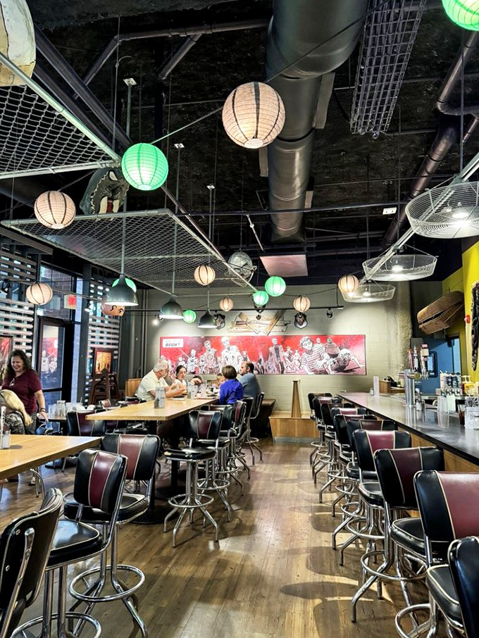 Communal tables under paper lanterns create the perfect setting for making friends or plotting survival strategies. Either way, there's good food.