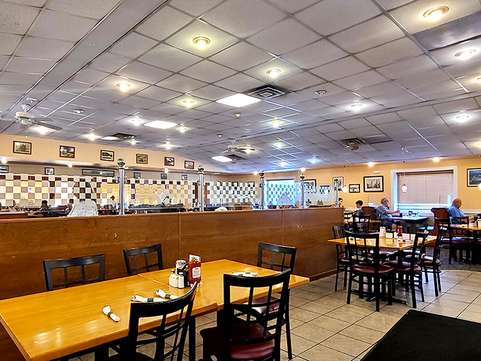 Classic diner seating arranged with the precision of a chess master&mdash;each table its own little island of potential culinary happiness.