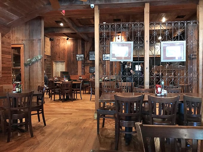 The dining room at Parrain's, where wooden walls have absorbed decades of happy conversations and the secrets of Cajun cooking.