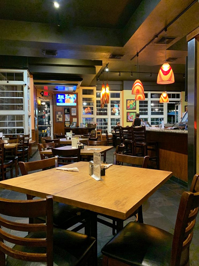 Warm lighting, wooden tables, and those distinctive pendant lamps create the kind of cozy atmosphere where breakfast easily stretches into lunch conversations.