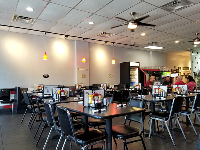 The dining area's simple, clean design with pendant lighting creates that perfect neighborhood caf&eacute; vibe where conversations flow as easily as the coffee.