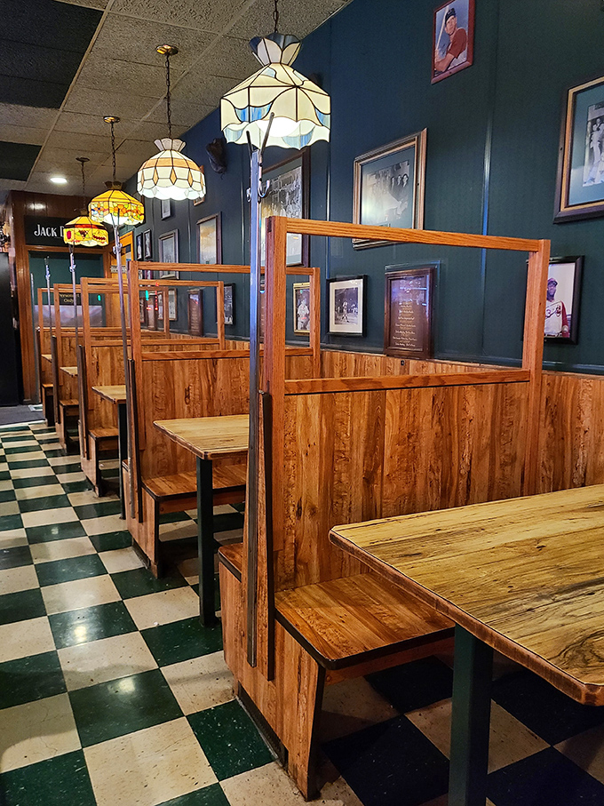 Wooden booths create intimate dining spaces where countless first dates and family celebrations have unfolded over decades of service.