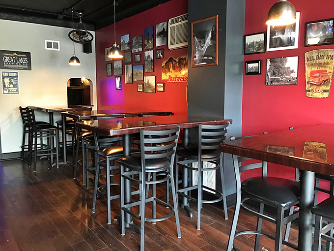 High-top tables and crimson walls create the perfect backdrop for both serious conversations and lighthearted banter over plates of comfort food.
