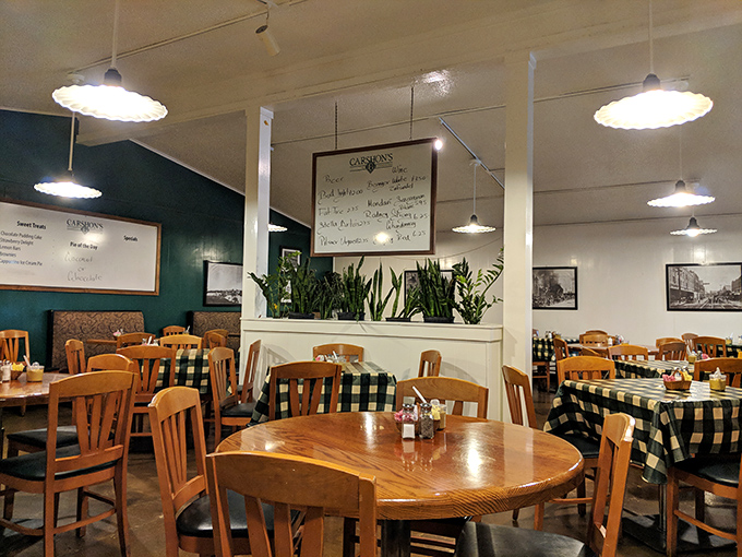 Black and white photos on the walls, plants adding life, and checkered tablecloths create that perfect "been here forever" deli ambiance we all crave.