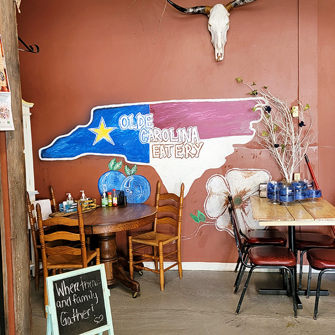 The hand-painted North Carolina silhouette mural says it all: "Where friends and family gather" isn't just a slogan here, it's the daily special.
