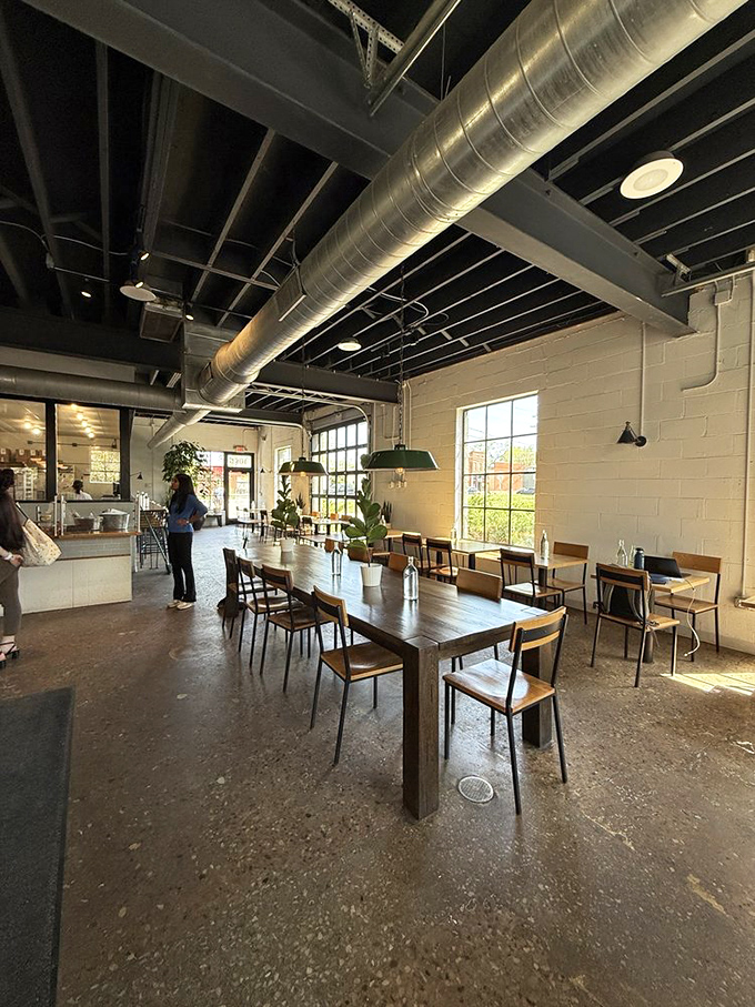 Exposed ductwork and natural light create the perfect backdrop for caffeine-fueled conversations. Industrial elements never felt so welcoming.