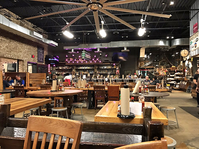 The dining room says "stay awhile" with its wooden tables and exposed ceiling. No pretension, just a space designed for the serious business of enjoyment.