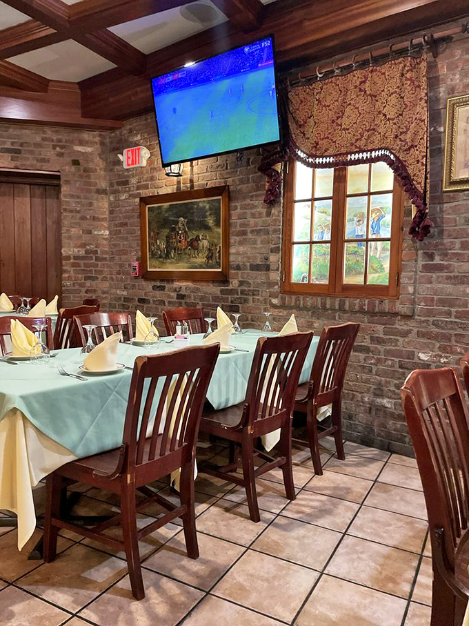 Where sports meet sophistication. This dining area proves you can watch the game while still feeling fancy enough to use the correct fork.