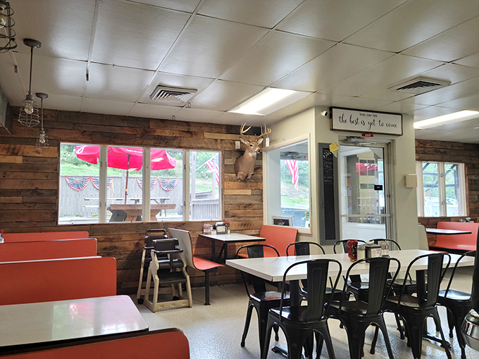 Rustic wood walls, coral booths, and a mounted deer head &ndash; this dining room feels like Pennsylvania's living room, where everyone's welcome.